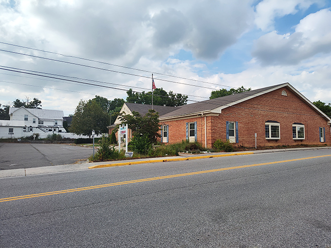 The library's brick steps lead to adventures bound in pages, where the only membership fee is returning your books on time.