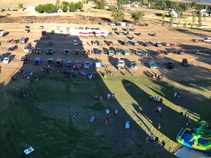 Bird's eye view of community in action&mdash;where cars, blankets, and inflatable slides create the perfect summer memory factory.