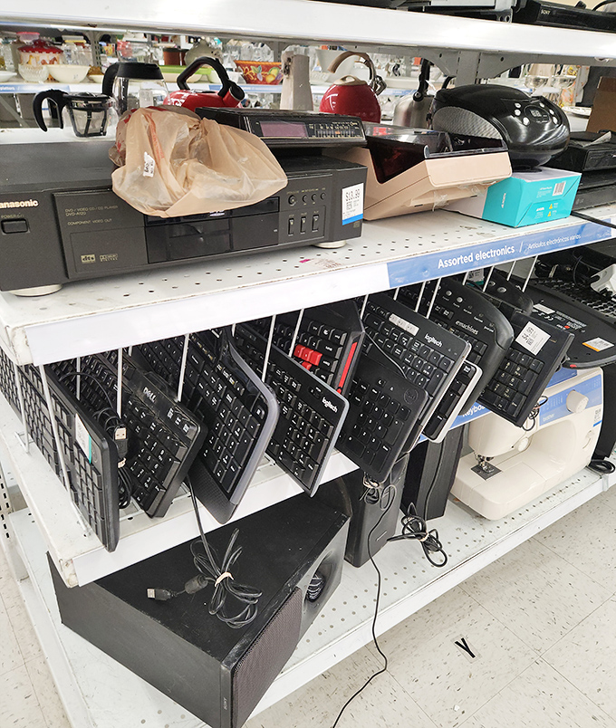 Technology time capsules line these shelves. That Panasonic DVD player remembers when Netflix came in red envelopes.