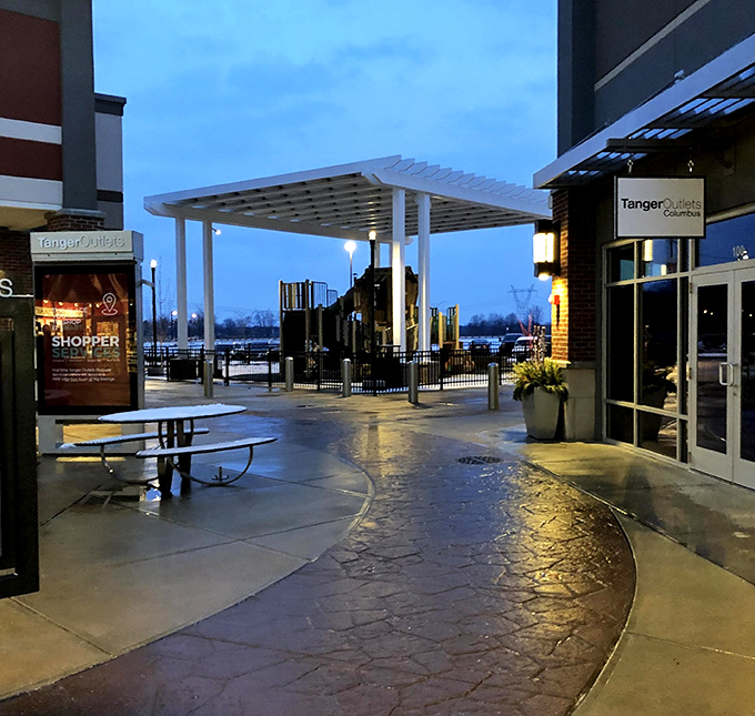 Evening lights transform the outlet into a glowing beacon for night owls seeking retail therapy.