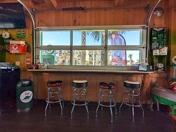 The garage-door-window bar seating: where Florida sunshine streams in while you fuel up. Those stools have probably heard more local stories than a small-town librarian.