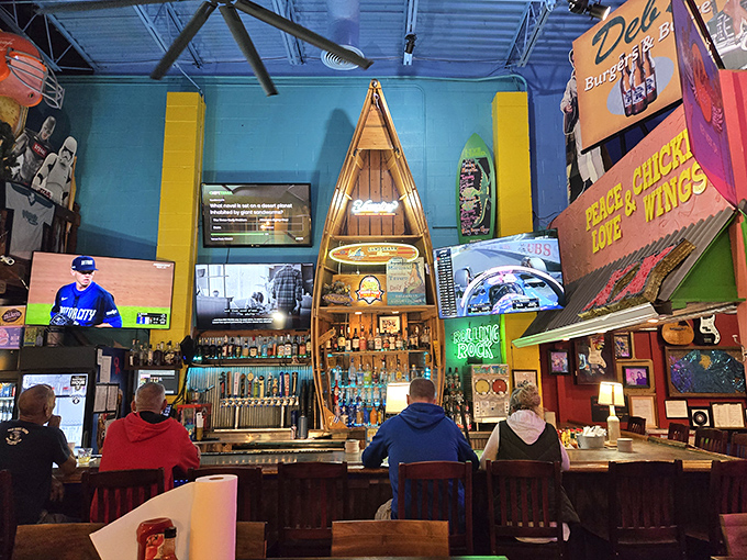 The bar area looks like it was decorated by someone who won a shopping spree at a sports memorabilia store and a neon sign factory.