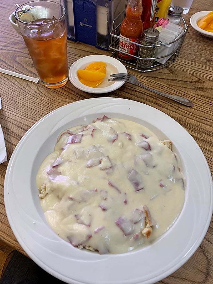 Biscuits and gravy that could settle family feuds. That creamy blanket of country gravy is hiding chunks of sausage like delicious buried treasure.