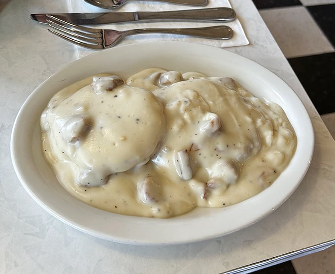 Biscuits and gravy that doesn't so much sit on the plate as luxuriate in it &ndash; a creamy, peppery blanket of comfort that demands to be savored.