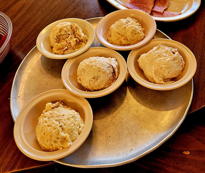 Buttery biscuits served with a side of Southern hospitality. These golden pillows of goodness are the perfect vehicles for sopping up every last bit of gravy.