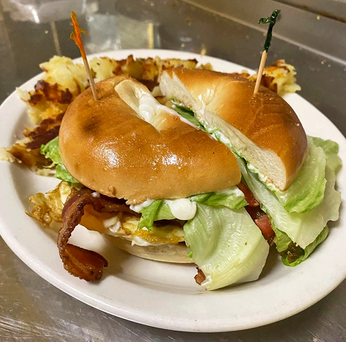 A breakfast sandwich that understands the importance of structural integrity. Layers of morning goodness held together by a perfectly toasted bagel.