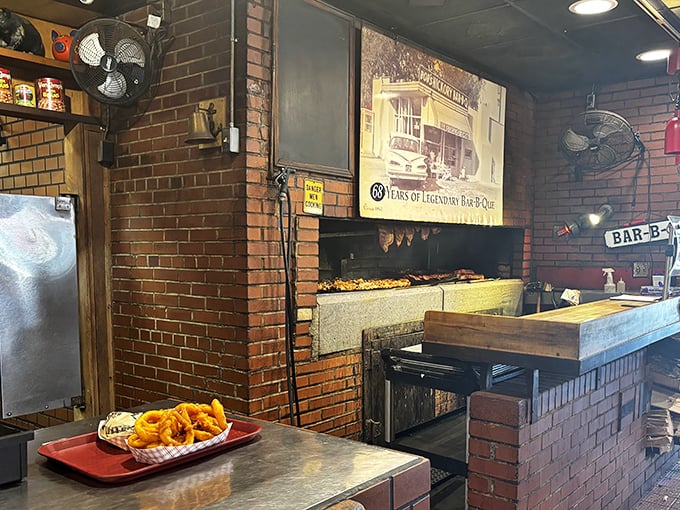 The brick pit&mdash;barbecue's holy ground where hickory smoke works its low-and-slow magic, transforming tough cuts into tender treasures that haunt your dreams.