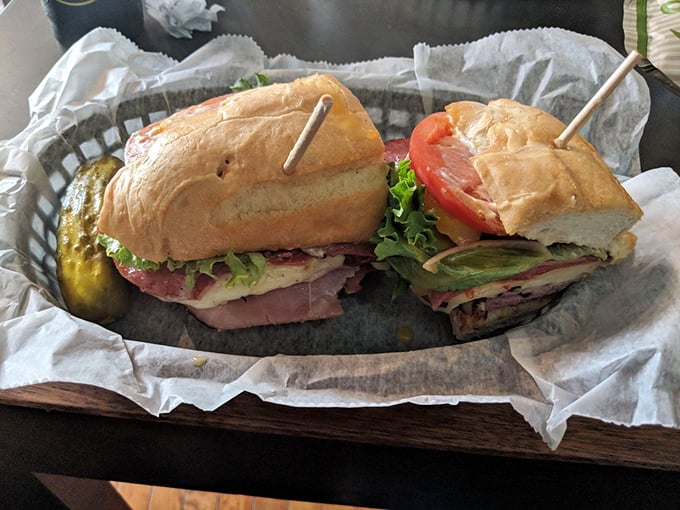 Served in a metal basket lined with paper&mdash;sandwich presentation at its most honest. No pretense, just two halves of heaven with a pickle sidekick.