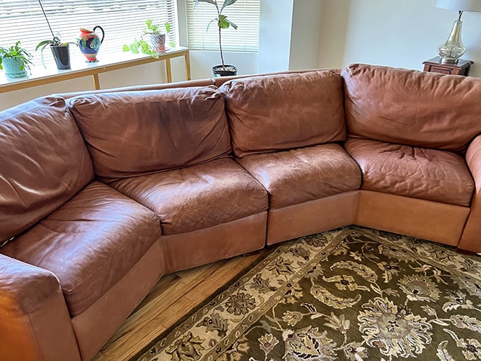 This buttery leather sectional has stories to tell, but plenty of comfortable conversations left to host in its new home.