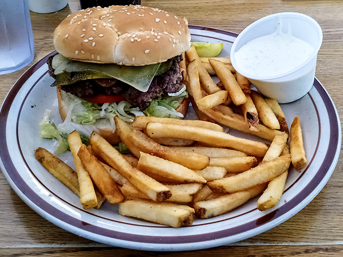A proper diner burger doesn't need aioli or artisanal anything – just quality beef, fresh toppings, and fries that snap when you bite them.