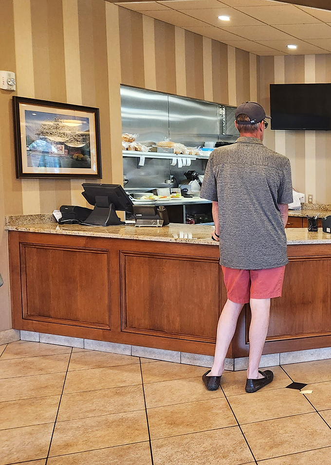 The moment of anticipation at the counter. Will it be the Reuben? The pastrami? Life's important decisions happen right here.