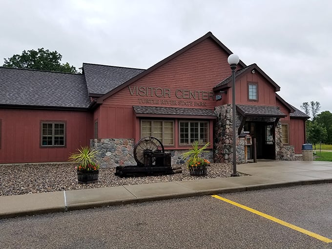 The rustic Visitor Center welcomes explorers with its distinctive stone-and-timber design, promising adventure and information in equal measure.