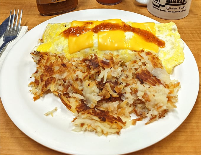 Breakfast doesn't get more honest than this&mdash;a perfectly executed omelet with hash browns crisped to golden perfection. Morning glory on a plate.