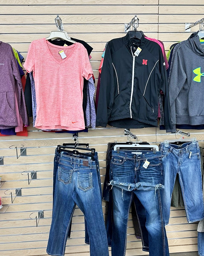 Designer jeans and athletic wear hang side by side, proving style doesn't require emptying your bank account.