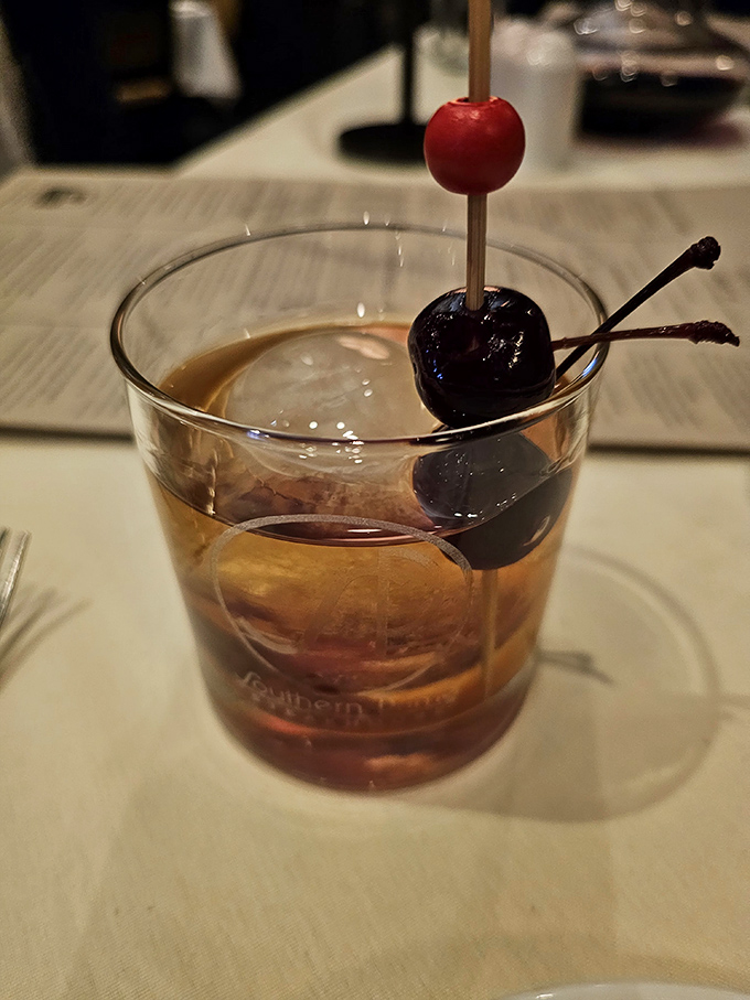 A well-crafted cocktail with cherries, because bourbon and beef have been best friends since the beginning of delicious time.