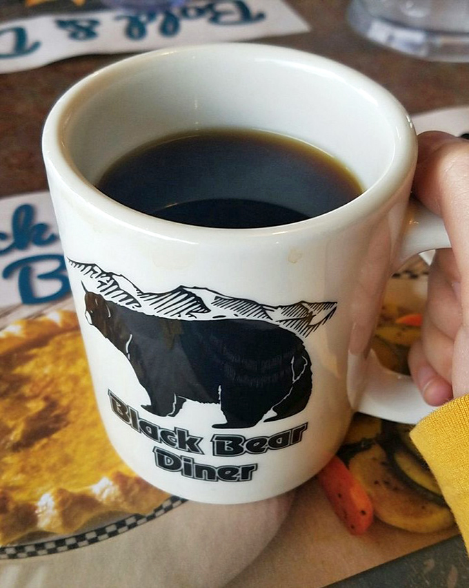 The coffee arrives in mugs big enough to qualify as soup bowls, featuring the iconic bear that watches over your caffeine ritual.