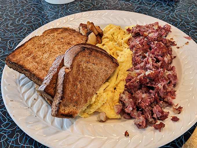 Corned beef hash with eggs and toast: breakfast of champions, hangover cure, and time machine to your grandmother's kitchen all in one.