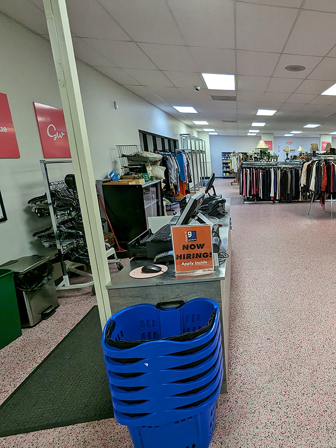 Command central, where treasures are processed and blue shopping baskets await. That "Now Hiring" sign hints at the community mission behind the bargains.