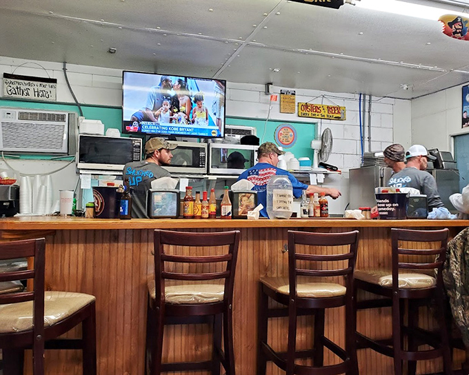 Where locals and tourists become temporary best friends, united by their mutual appreciation for perfectly prepared seafood and cold drinks.