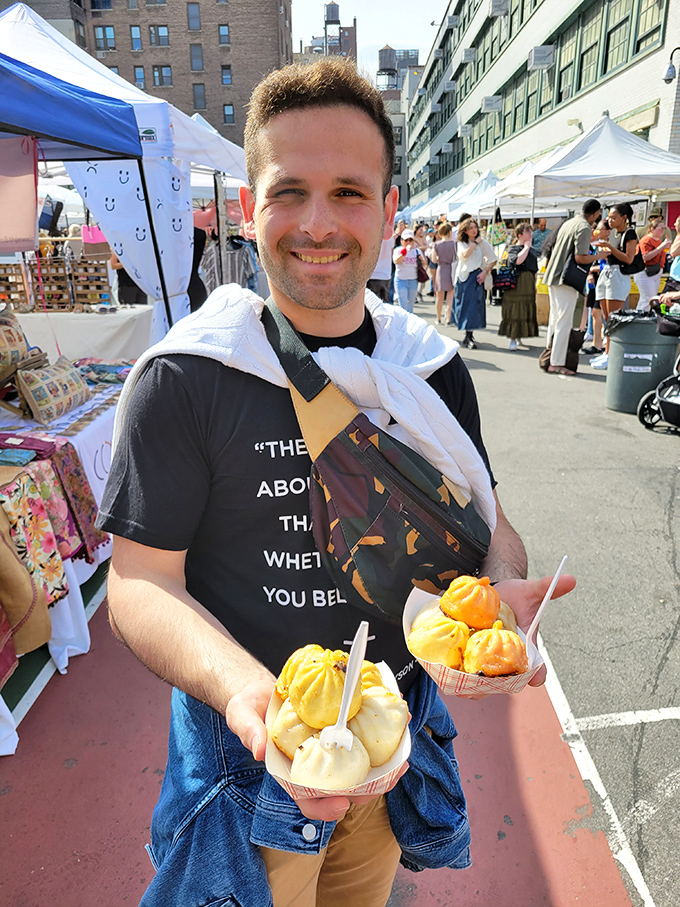 The joy of street food discovery captured in one smile! Dumplings so good they've clearly triggered an endorphin release visible from space.