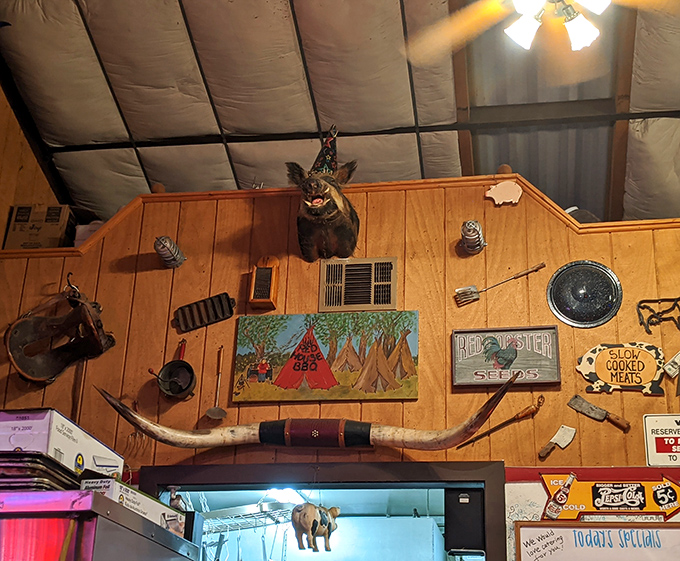 The ceiling decor proves that in BBQ country, taxidermy and vintage tools aren't just decoration&mdash;they're conversation starters between bites of brisket.