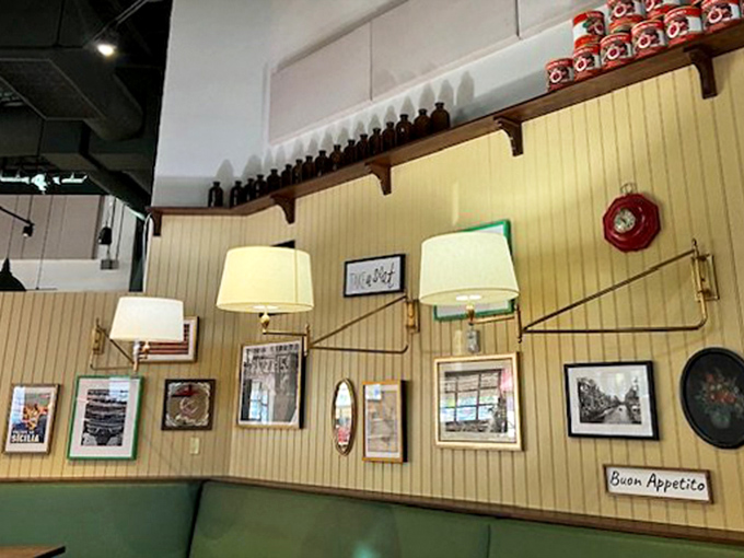 Warm lighting and Italian-inspired wall decor create the perfect backdrop for carb-loading. "Buon Appetito" indeed!