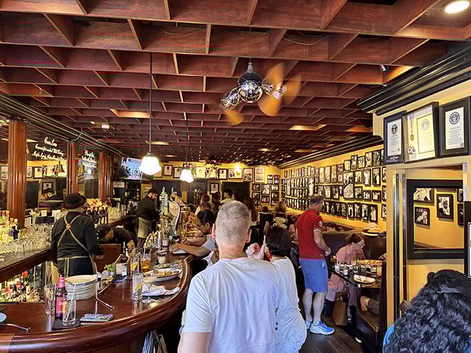 The bustling interior, with its wood-coffered ceiling and walls of accolades, feels like pizza's hall of fame.