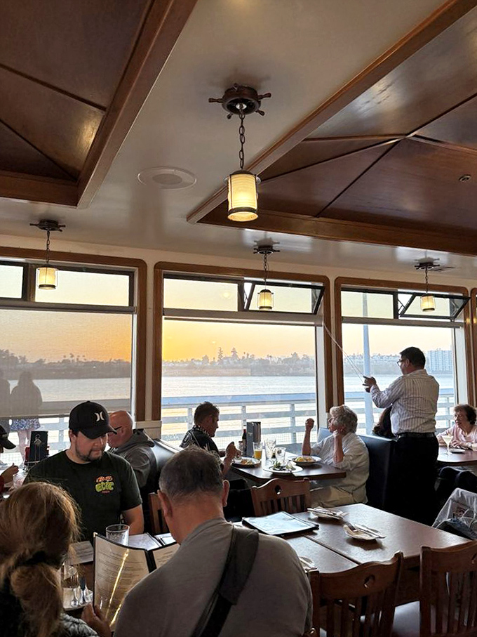 As golden hour bathes the dining room, conversations flow as freely as the seafood from kitchen to table, creating that perfect dinner ambiance.
