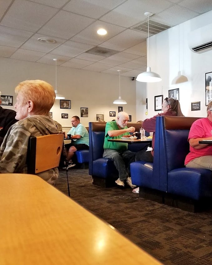 Blue booths cradle conversations that range from local politics to grandchildren's achievements. The modern-day town square where Toledo connects over comfort food.