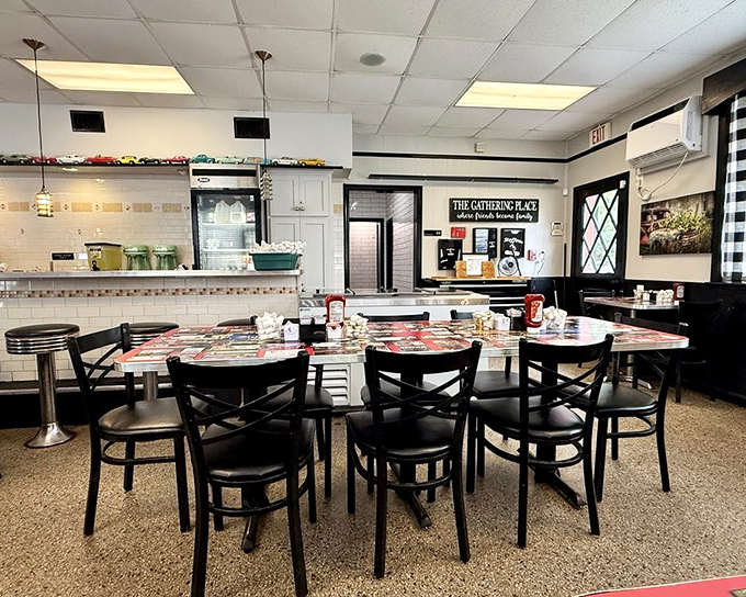 The clean, welcoming interior with its model car collection above&mdash;where every table feels like the best seat in the house.