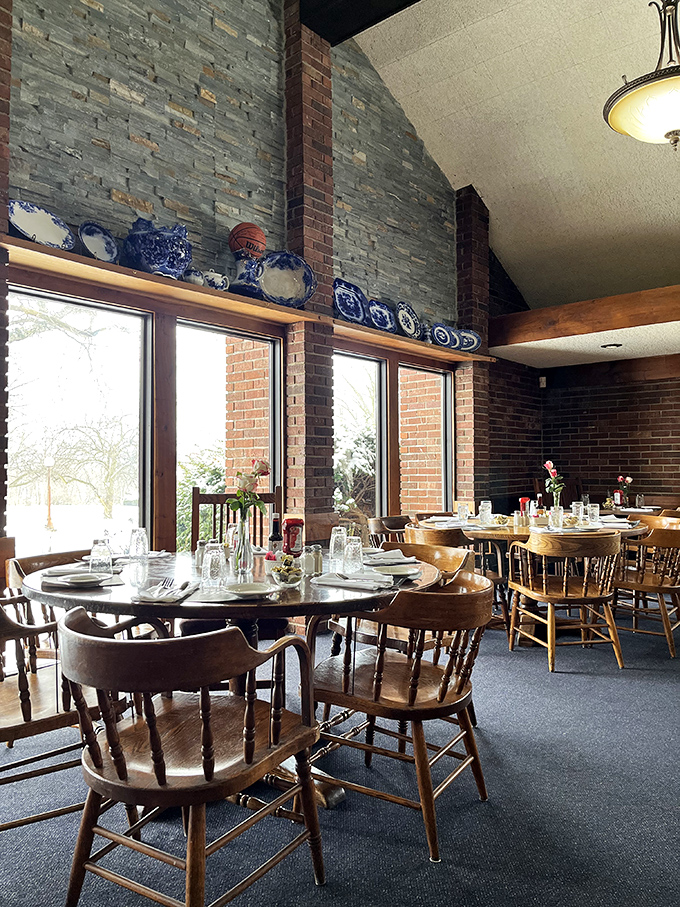Large windows flood the dining room with natural light, illuminating tables where generations of families have celebrated life's special moments.