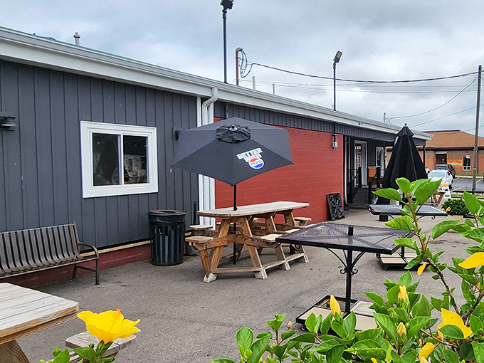 Outdoor seating with picnic tables and umbrellas for those who want their rib feast with a side of fresh air.