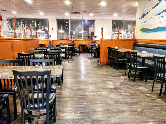 The evening dining room waits patiently for its next round of hungry guests—tables ready, chairs aligned, deliciousness imminent.