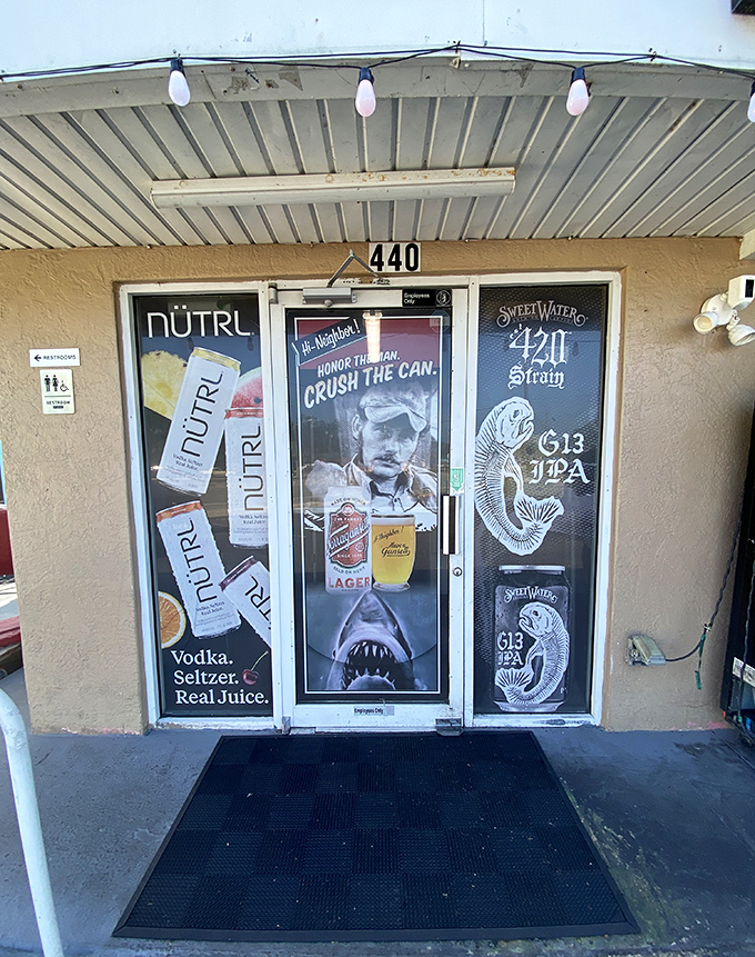 The entrance door showcases local brews and beach vibes. Like walking through a portal to Flavor Country, no passport required.