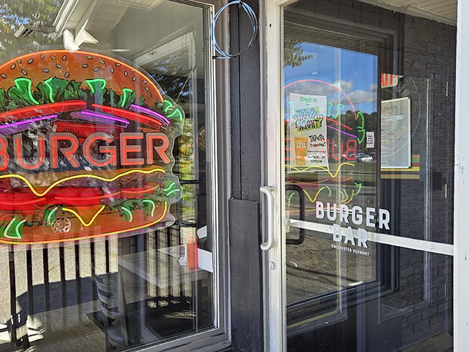 The neon burger sign in the window serves as a beacon, calling hungry travelers to pull over and experience something legitimately good. 