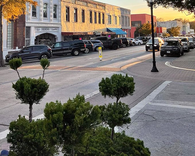Golden hour bathes downtown Brenham in magical light, transforming ordinary buildings into something worthy of a Texas tourism brochure.