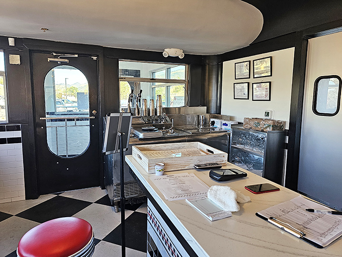 The entrance to food paradise. That checkerboard floor isn't just decoration; it's your first clue that this place takes the classics seriously.