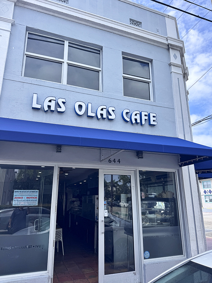 The bright white facade and blue awning of Las Olas Cafe create the perfect storefront for this beloved Cuban eatery.