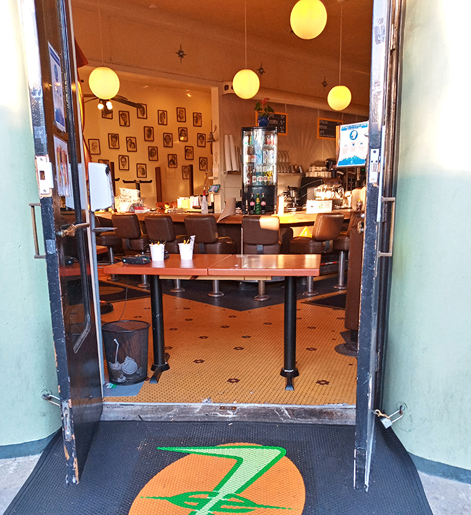 The entrance floor logo welcomes you like a secret handshake into Los Feliz's 24-hour club for the hungry and sleepless.