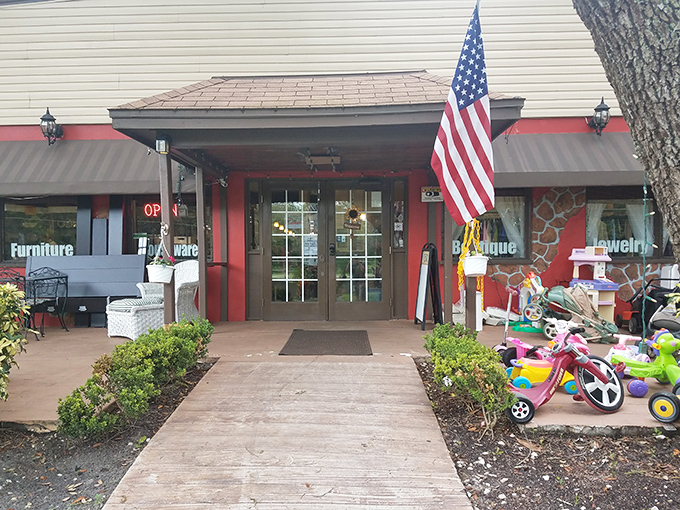 The welcoming entrance, complete with American flag and children's toys, sets the tone for this community-minded shopping adventure.