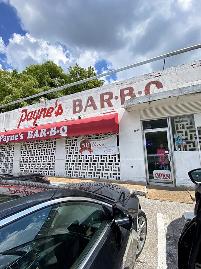 The entrance beckons with its "OPEN" sign&mdash;a portal to one of Memphis's most cherished barbecue experiences. Step inside and join the faithful.