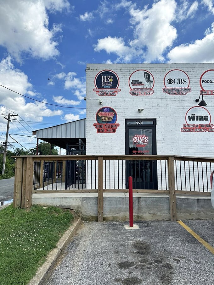 Badge of honor! The impressive collection of media recognition on this entrance wall serves as a barbecue resume few establishments can match.