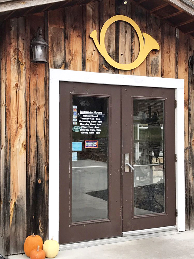 The entrance says it all: wooden warmth, a golden horn logo, and seasonal pumpkins that signal "real food served by real people" awaits inside.