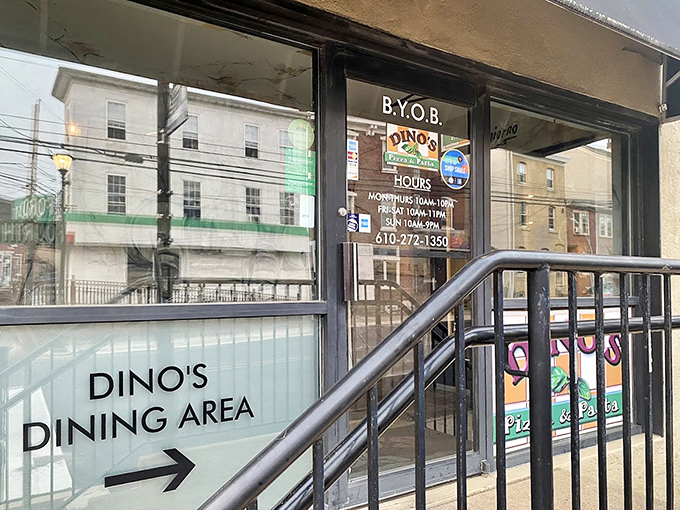Dino's storefront proudly announces its pizza heritage with signs that practically whisper, "Yes, this is the real deal you've been searching for."