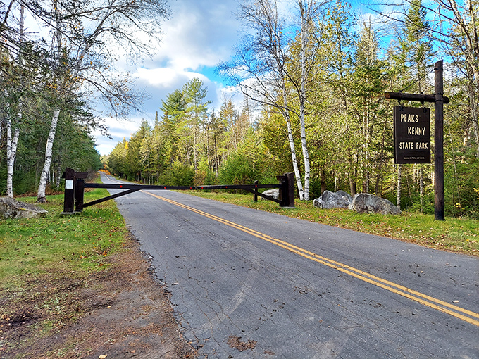 The entrance to paradise isn't pearly gates but a simple wooden barrier. Beyond lies the Maine that postcards can only hint at.