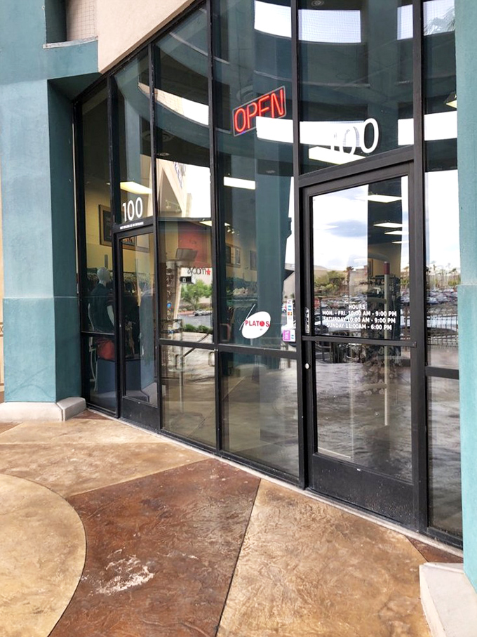 The gateway to affordable style. That neon "OPEN" sign might as well say "OPPORTUNITY" for fashion-forward bargain hunters.