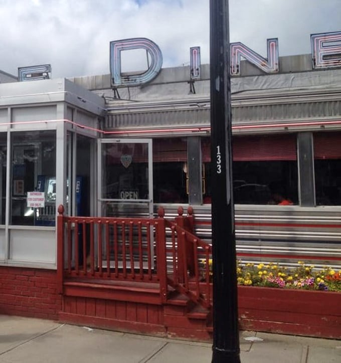 The classic diner silhouette stands proudly on Main Street, a chrome-clad beacon calling hungry travelers home since before GPS existed.