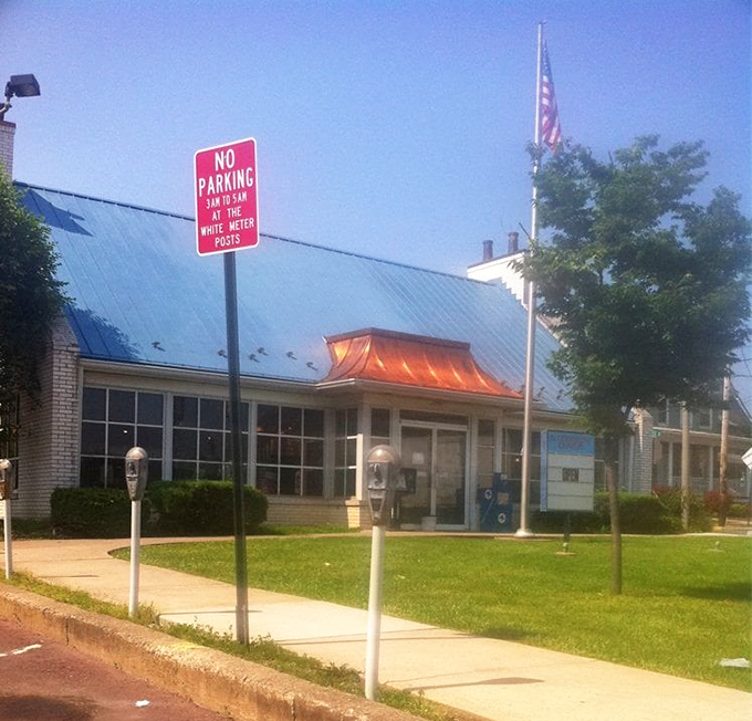 Morning light bathes the diner's exterior in golden possibility &ndash; the architectural equivalent of "rise and shine."