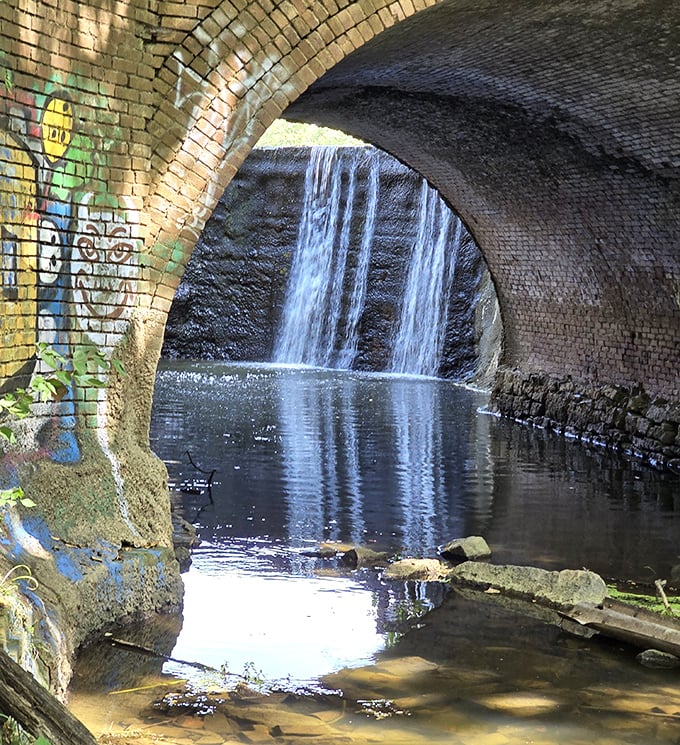 Water choreographs its own dance beneath this stone arch. Nature's version of Broadway, running continuously since the Ice Age.