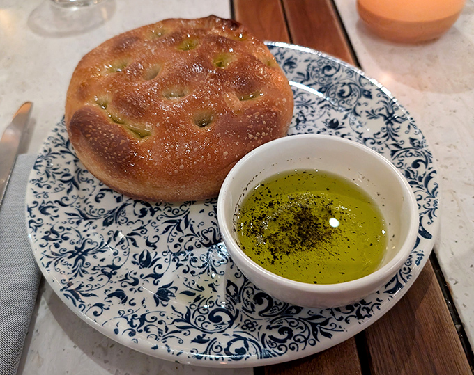 Focaccia that doesn't just accompany your meal—it demands attention, with its pillowy interior and olive oil bath that's practically a spa treatment for bread.